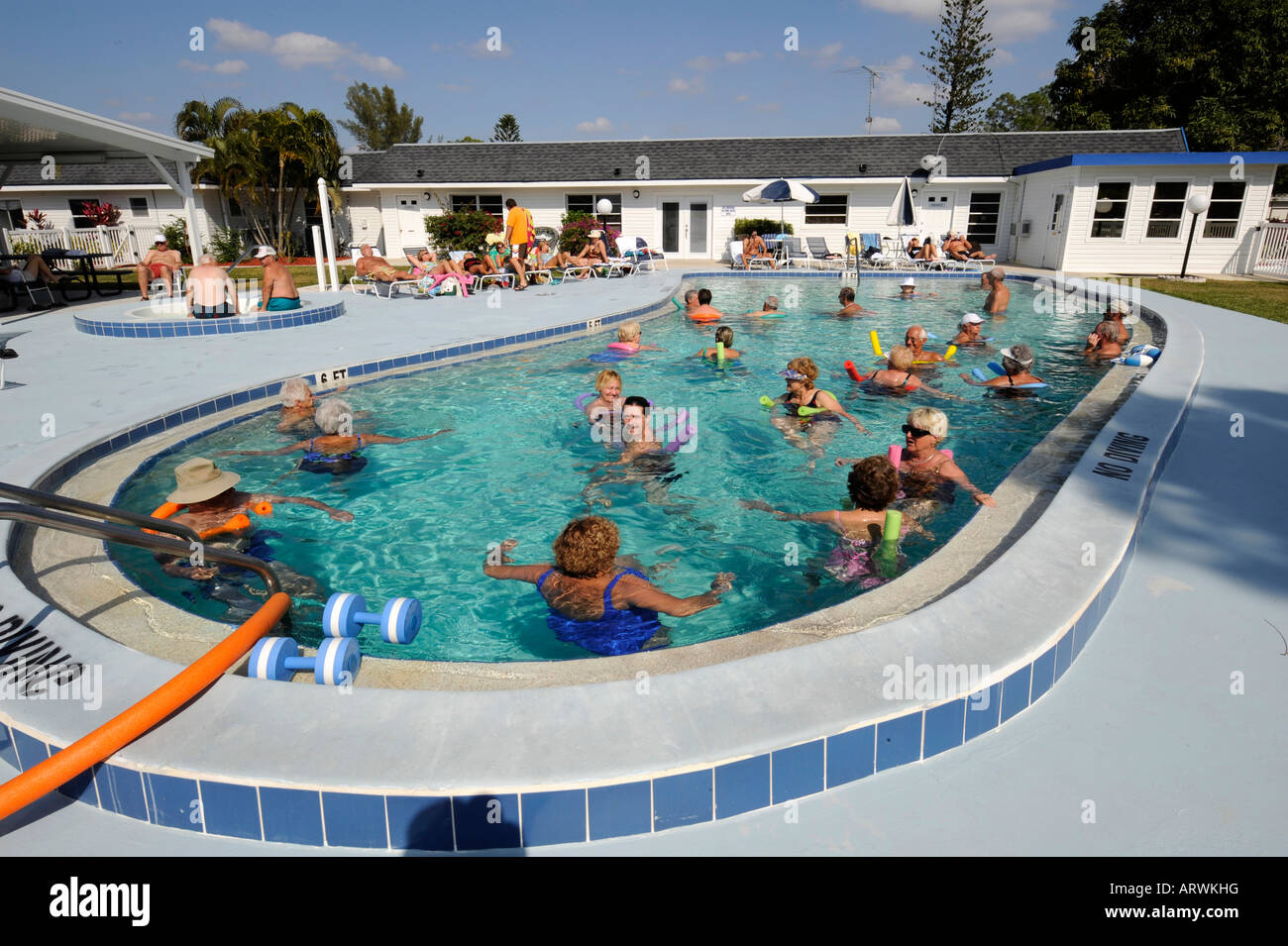 Senior citizens enjoying retirement in a resort swimming pool Stock ...