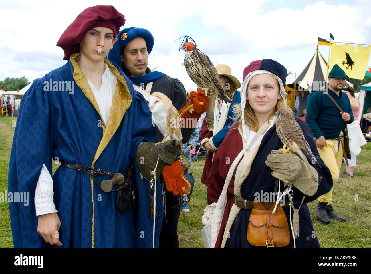 3 Medieval Characters and Hunting Birds Demonstrate Pecking Order ...