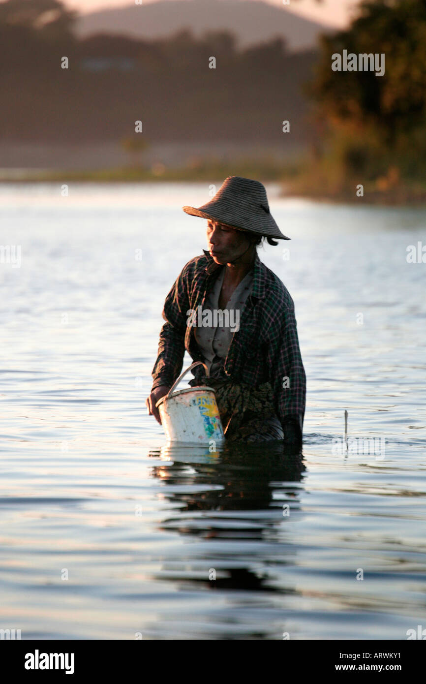 Burmese woman fishing in Taungthaman Lake, Amarapura, Burma, (Myanmar ...
