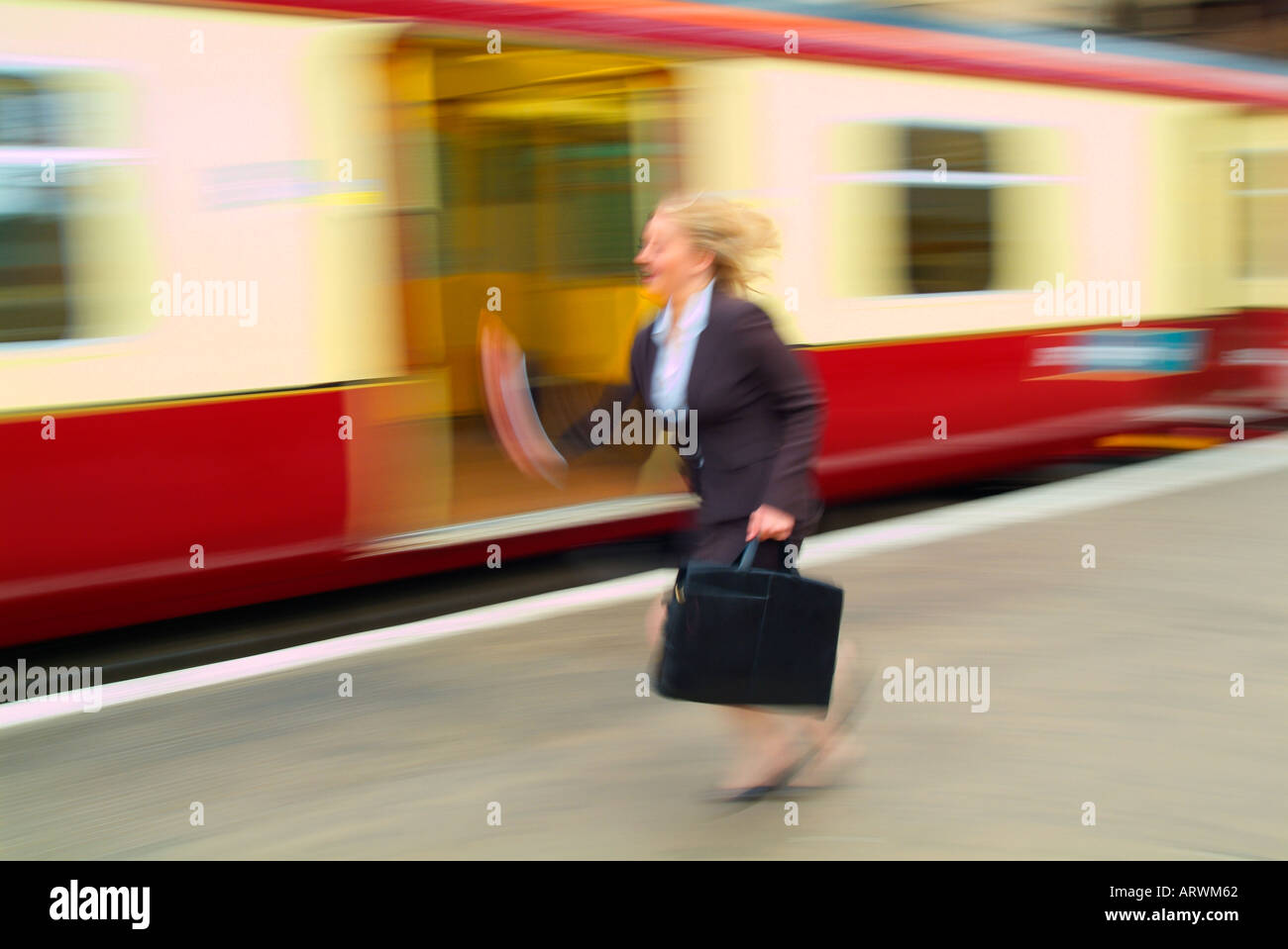 Businesswoman running train hi-res stock photography and images - Alamy