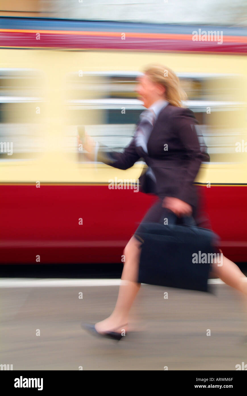Businesswoman running train hi-res stock photography and images - Alamy