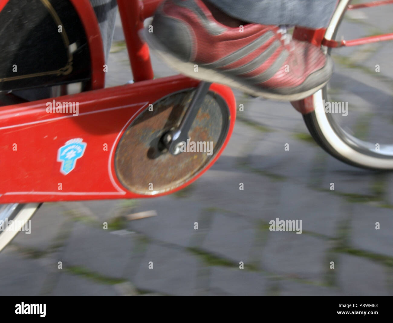 detail of foot pedalling on old style red bike Stock Photo - Alamy