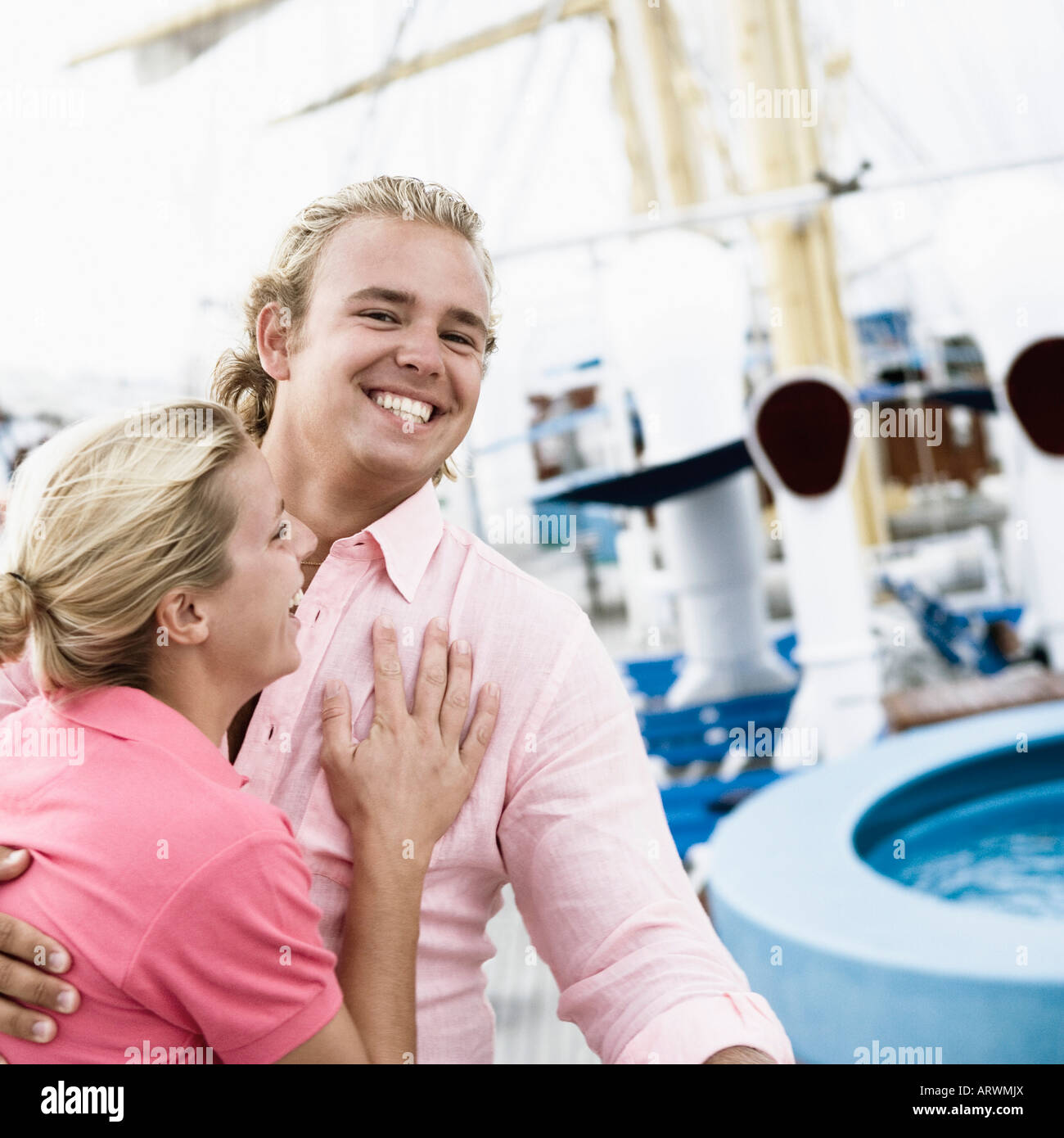 Young couple embracing each other and smiling Stock Photo - Alamy