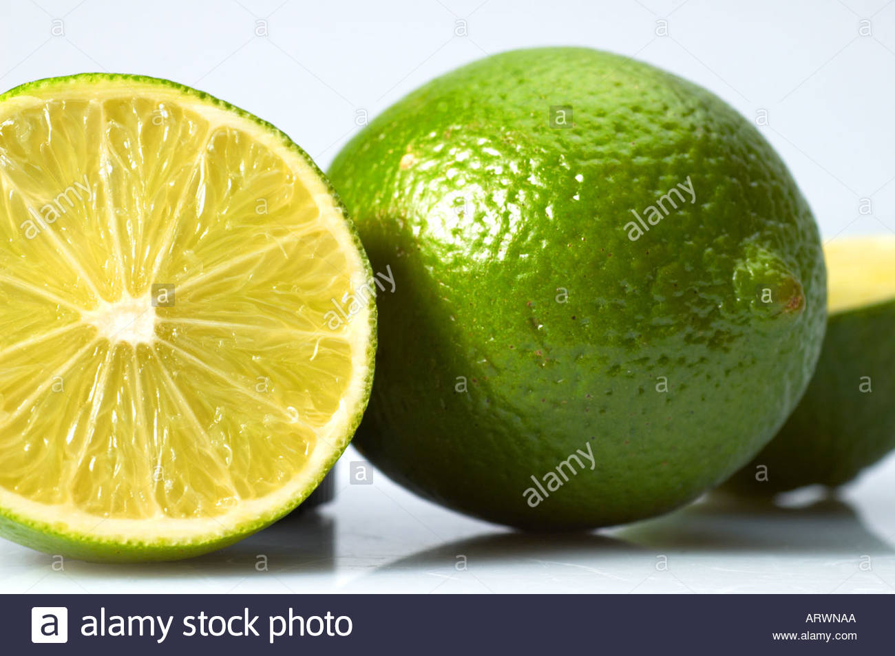 Whole sliced green limes hi-res stock photography and images - Alamy