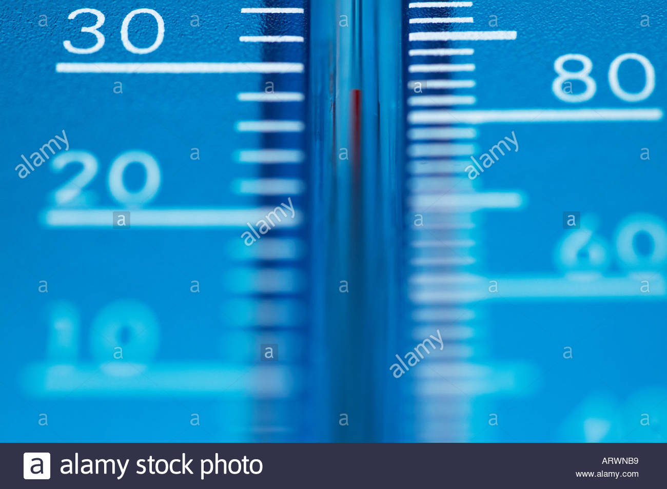 A clear blue thermometer Stock Photo - Alamy