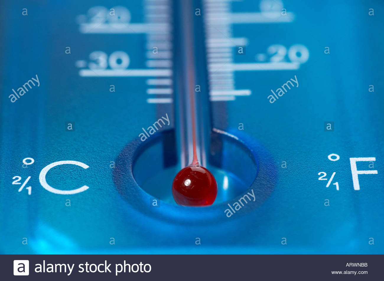 A clear blue thermometer Stock Photo - Alamy