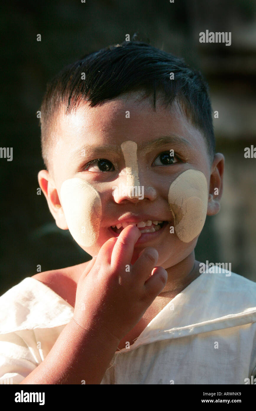 Burmese girl wearing thanakha at the market in Bagan, Burma, (Myanmar ...
