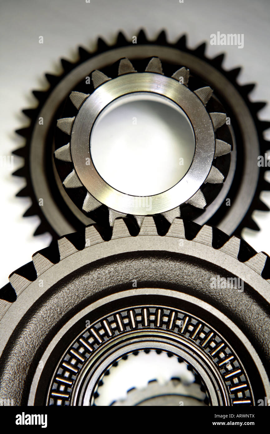 Steel gears meshing together Stock Photo - Alamy