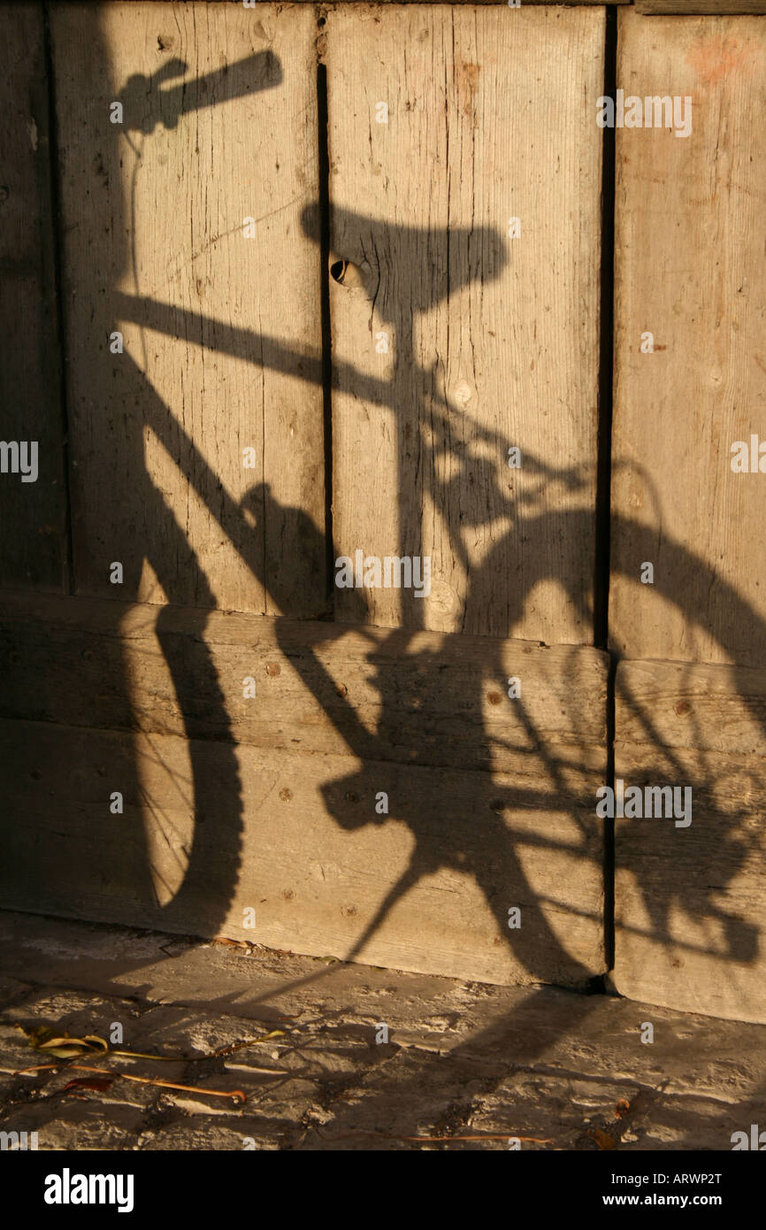 bike shadow on wooden door Stock Photo - Alamy