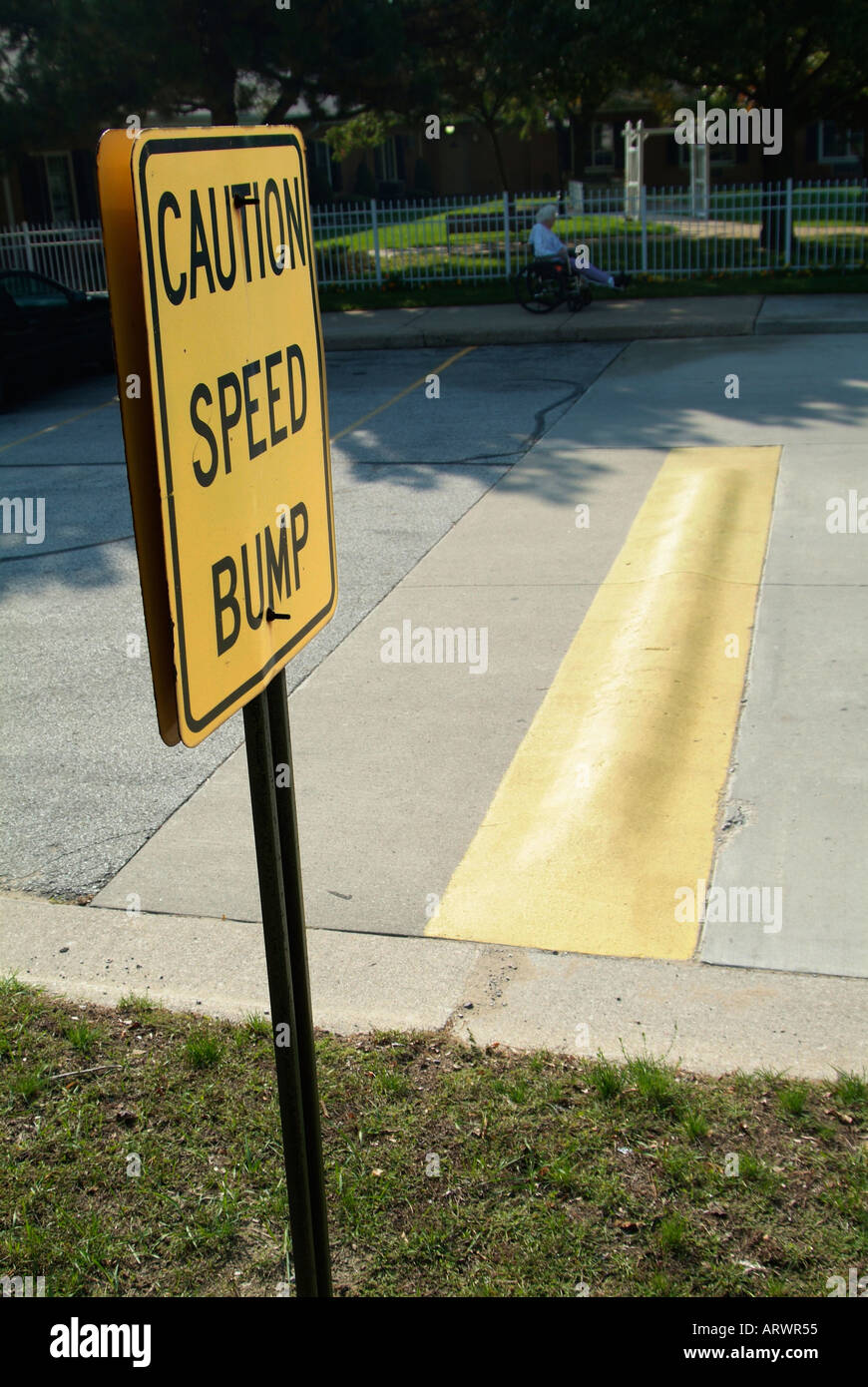 Speed bump on a road to force traffic to drive slowly traffic sign ...