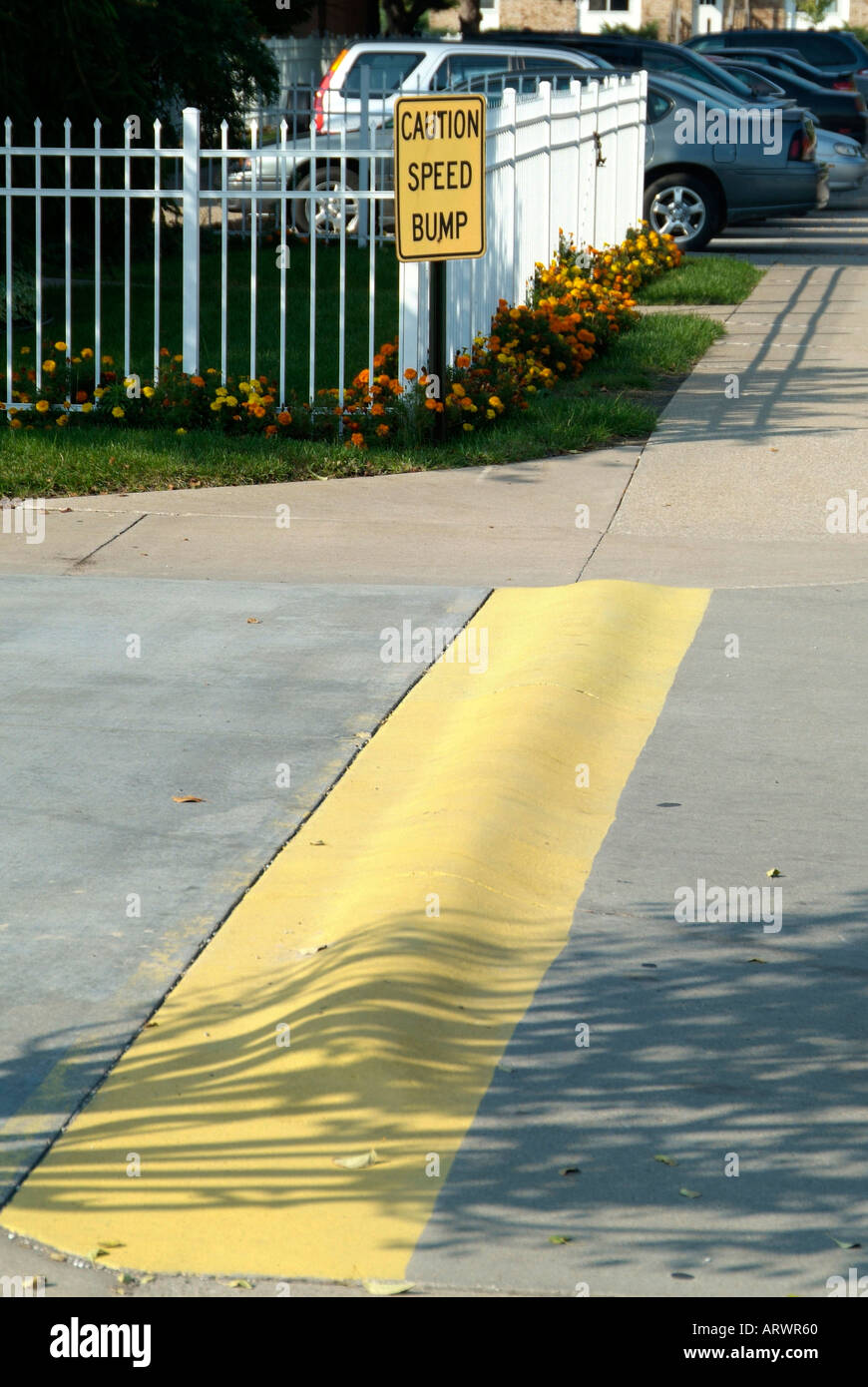 Speed bump on a road to force traffic to drive slowly traffic sign ...