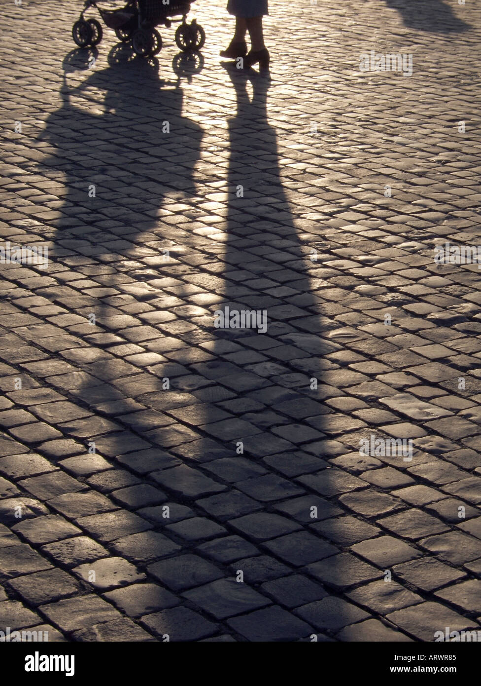 shadow of person pushing pram Stock Photo - Alamy