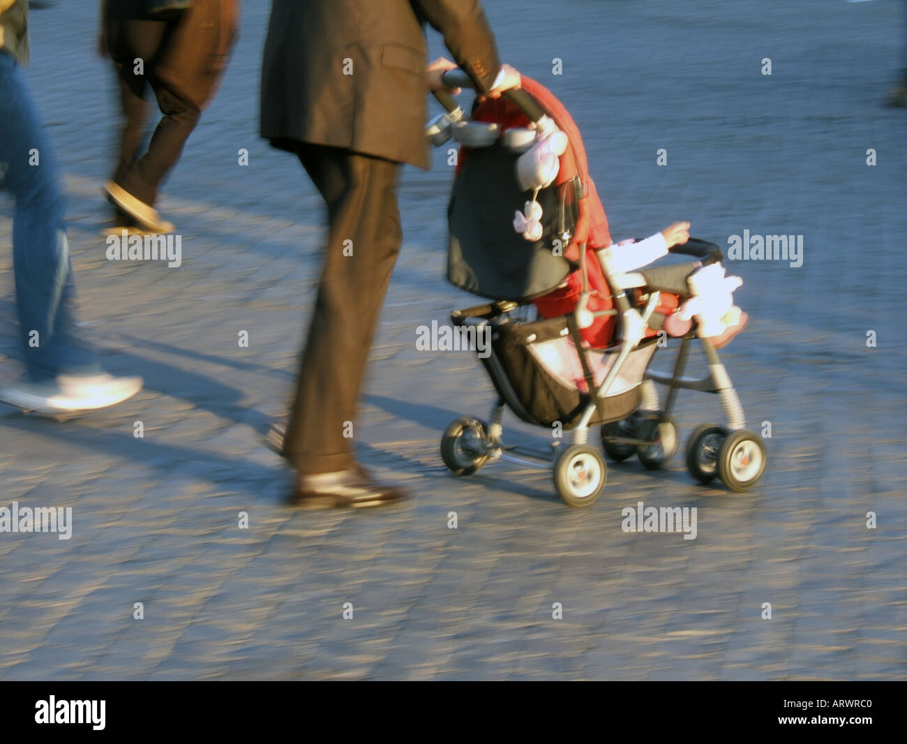man pushing pram Stock Photo - Alamy