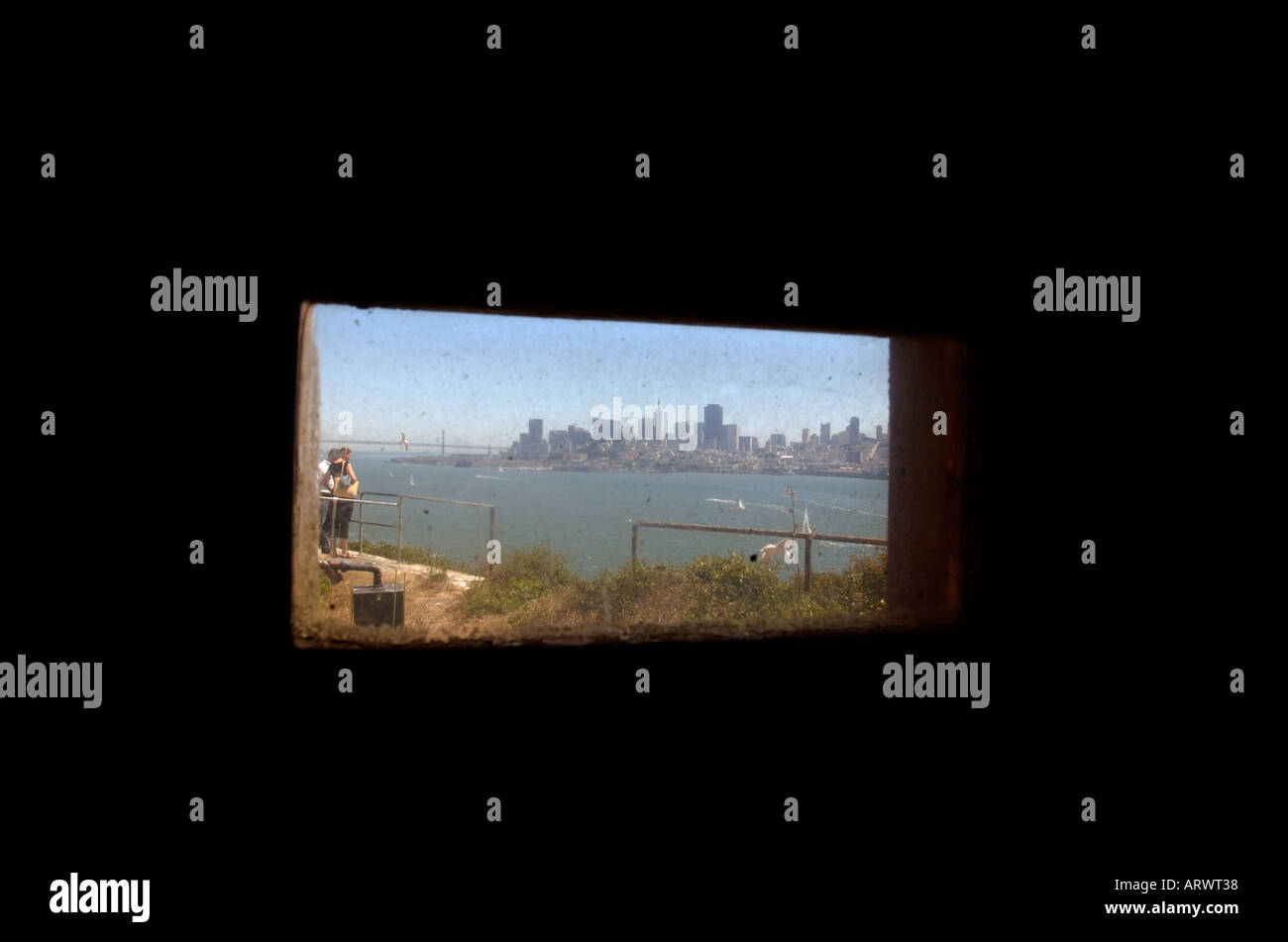 Narrow window with view of city in background, Alcatraz Penitentiary ...