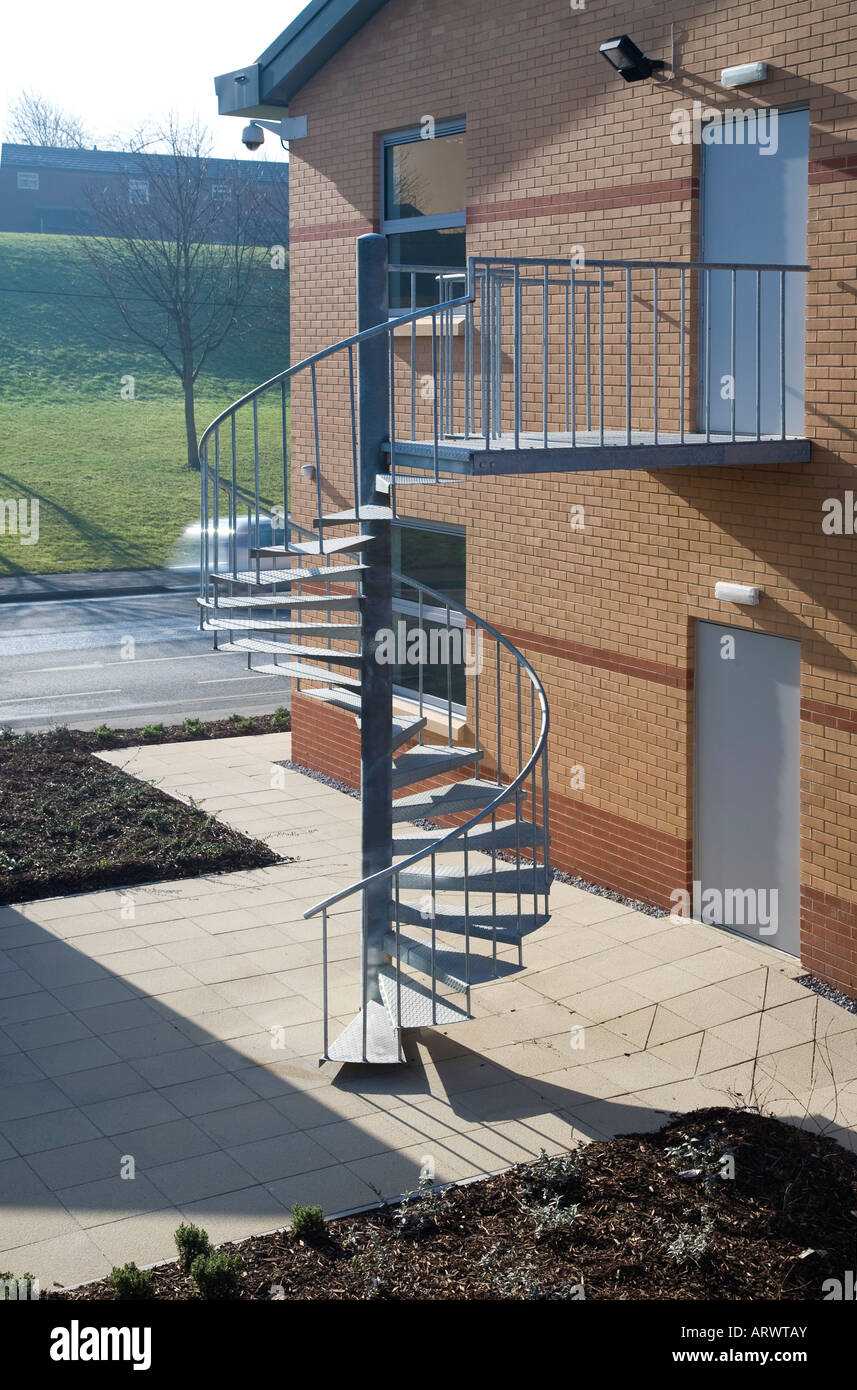 Fire escape on a modern office building with a car zooming past Stock ...