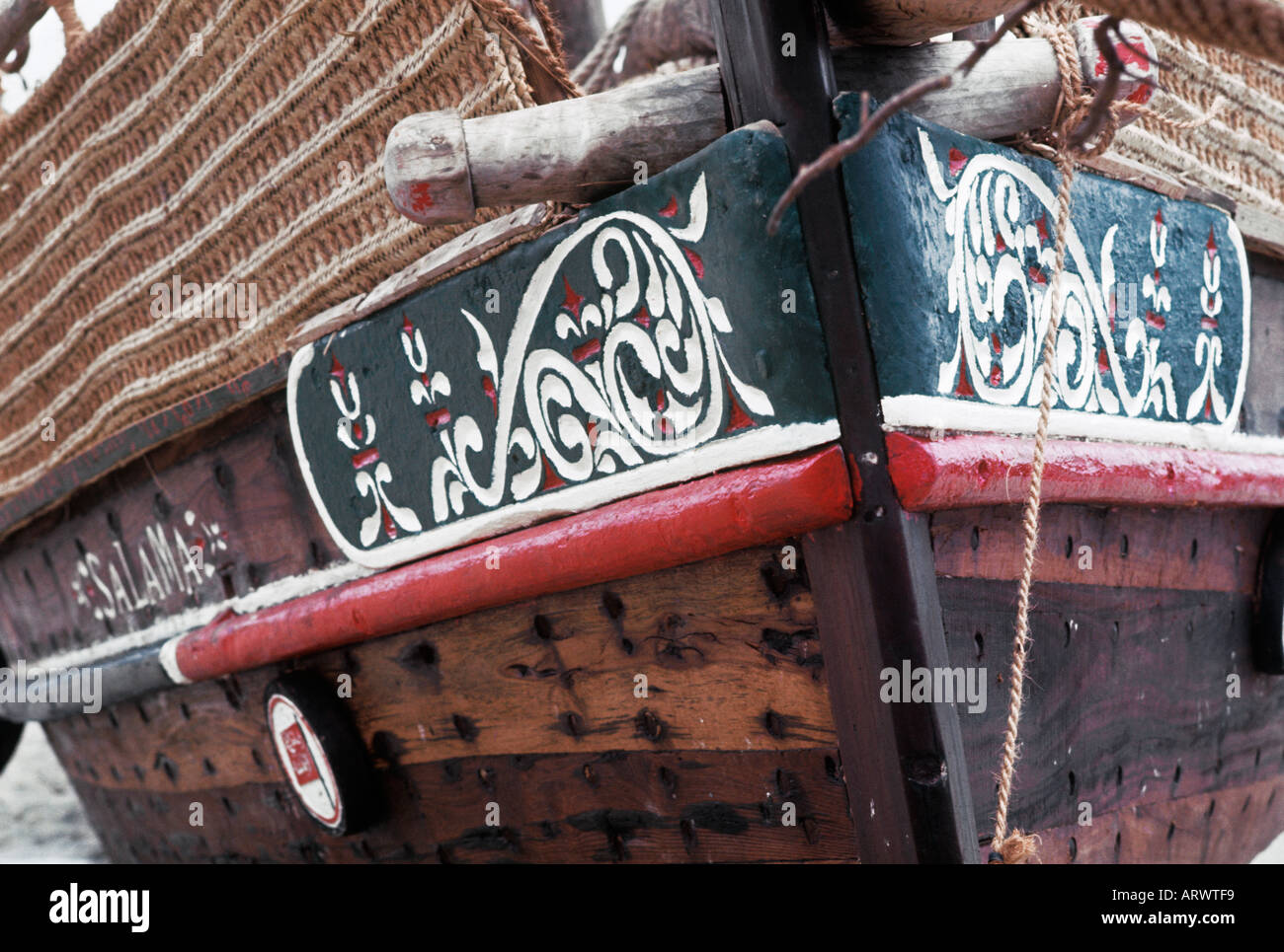 Beautiful carving adorns the prow of a wooden fishing boat at Lamu on ...