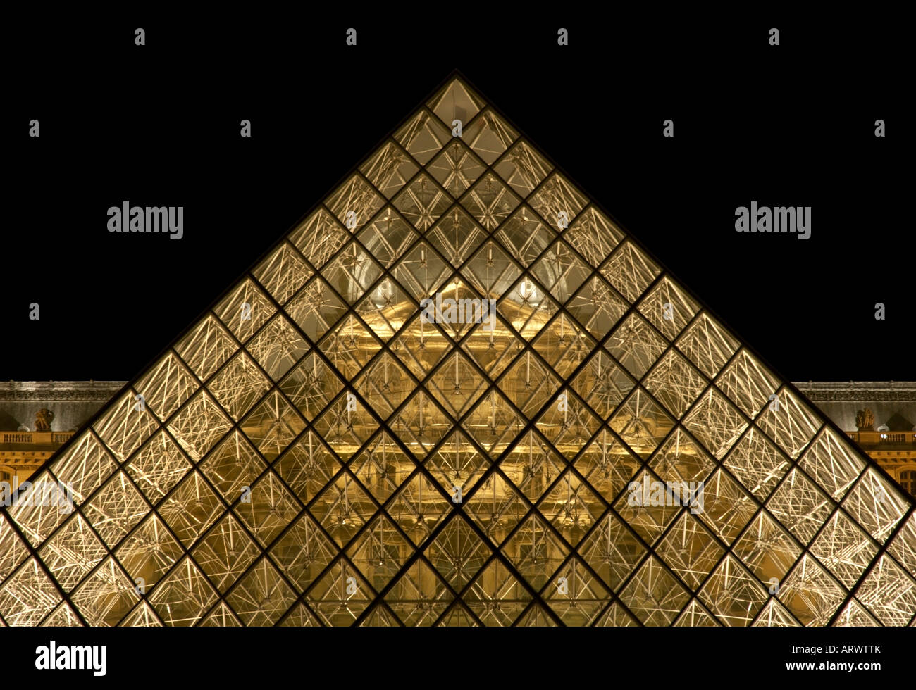 Sully wing of the Louvre viewed through the pyramid at night Stock ...