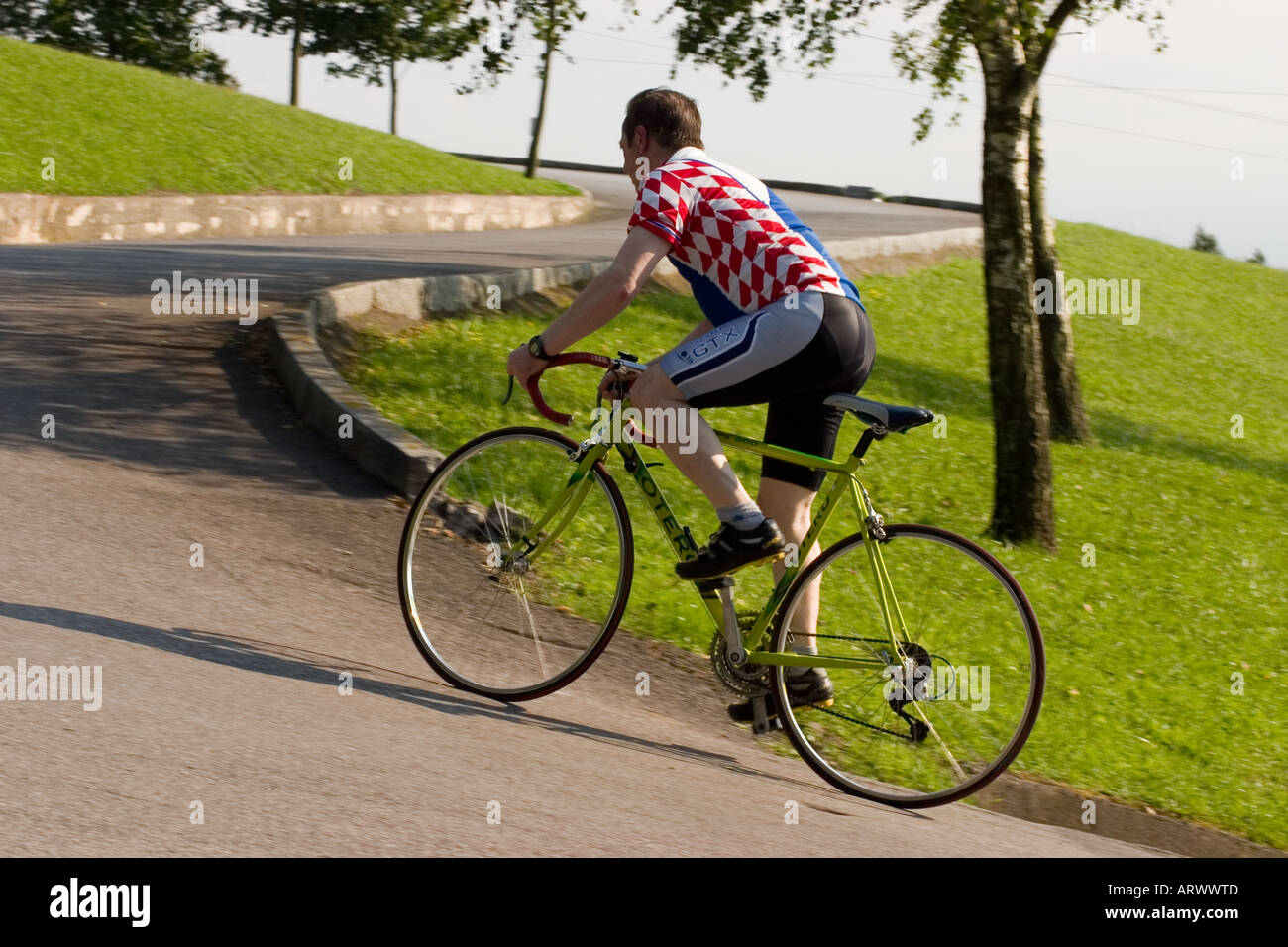 Cyclist struggling uphill hi-res stock photography and images - Alamy