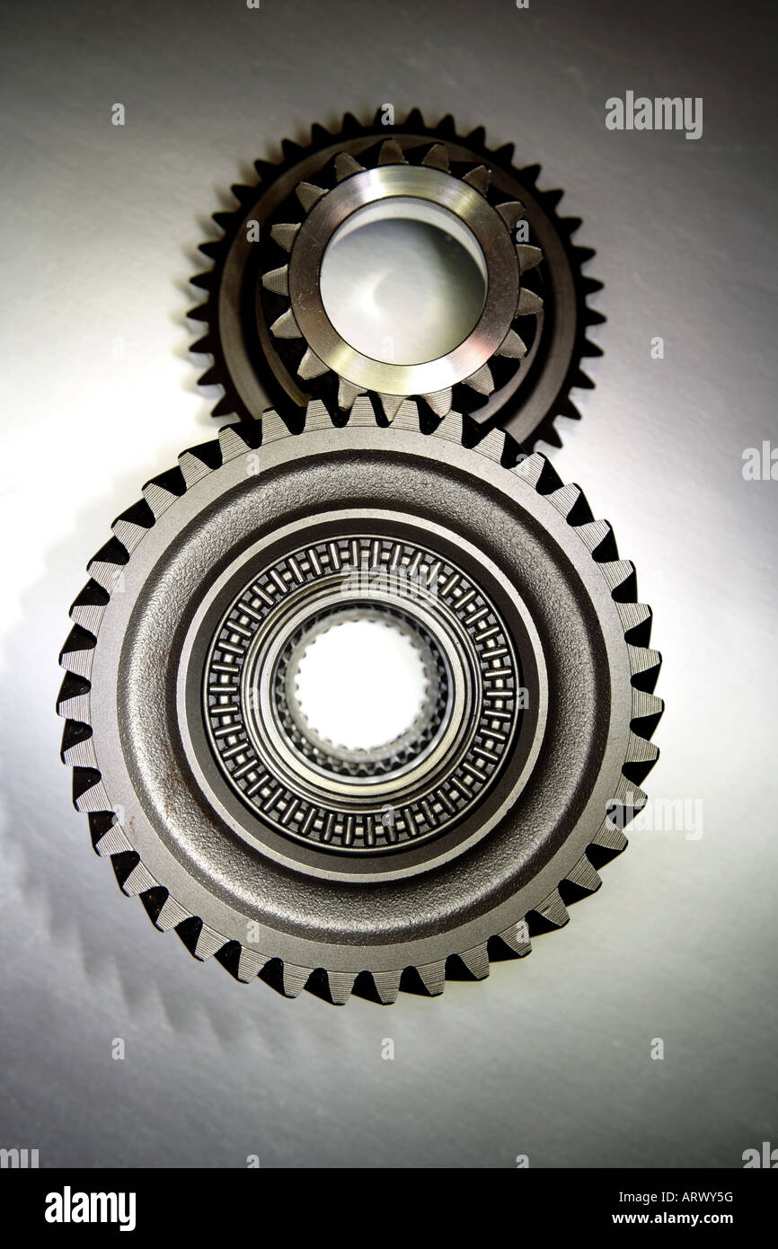 Two gears meshing together Stock Photo - Alamy