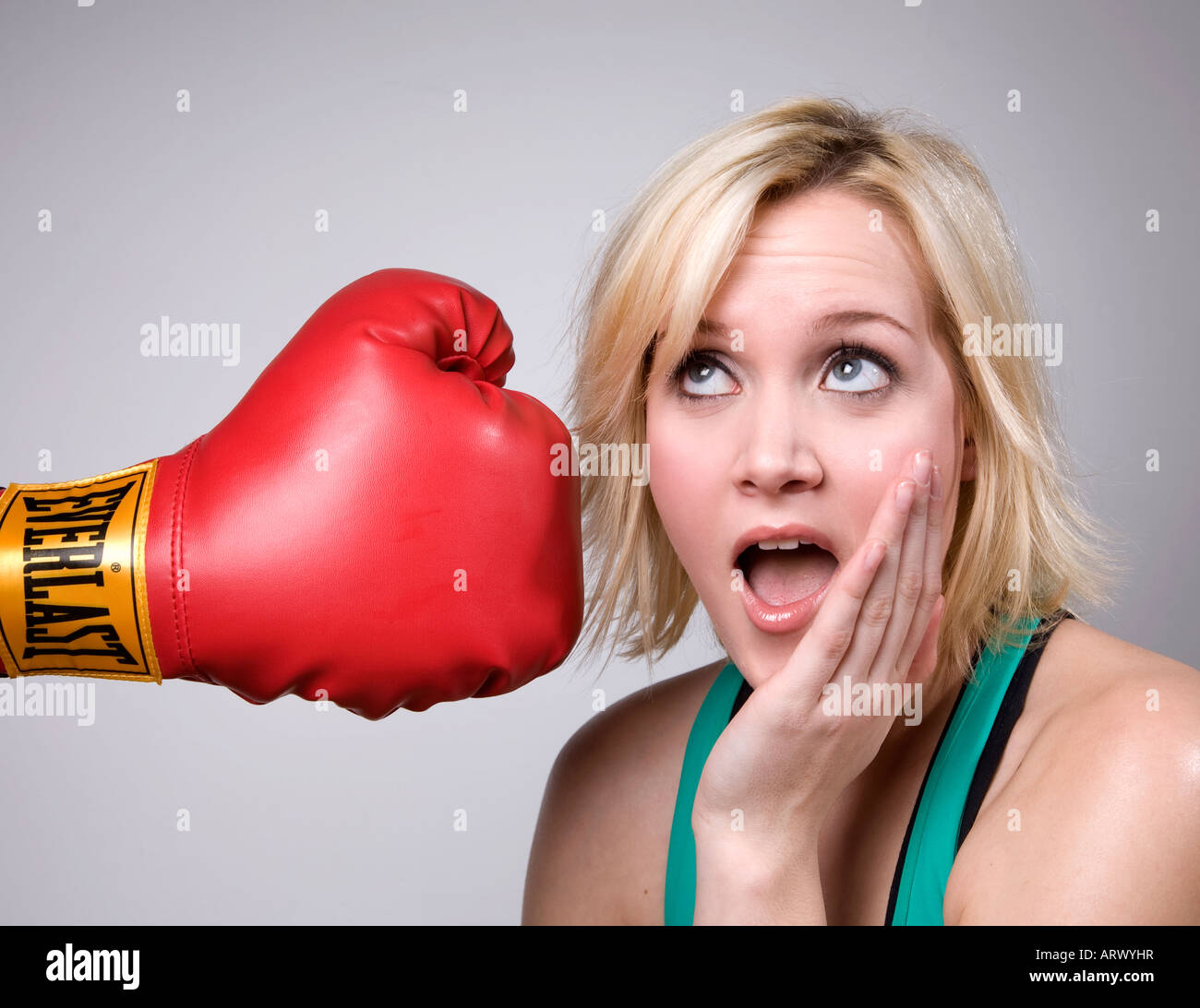 attractive woman hit by boxing glove Stock Photo - Alamy