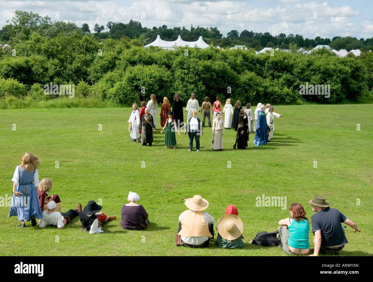 Medieval Reenactors Sit Watching Circle of Worshippers at Druid ...