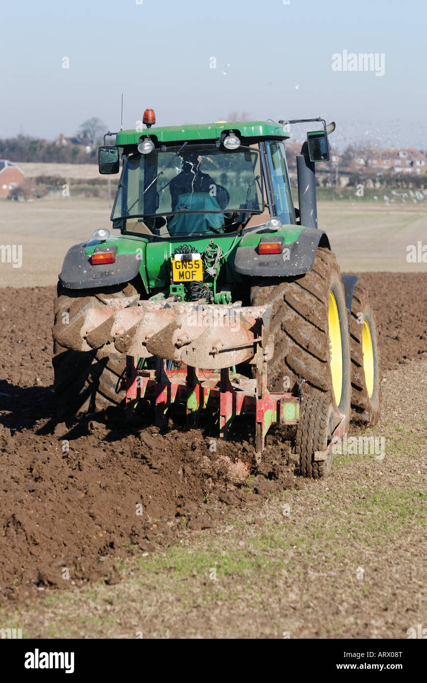 Tractor ploughing field ready for crops in Kent Stock Photo - Alamy