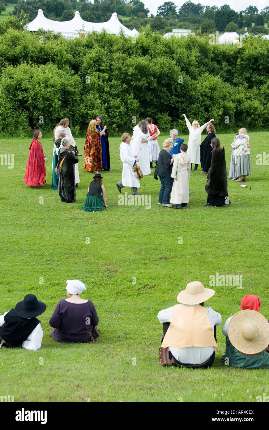 Medieval Reenactors Sit Watching Circle of Worshippers at Druid ...