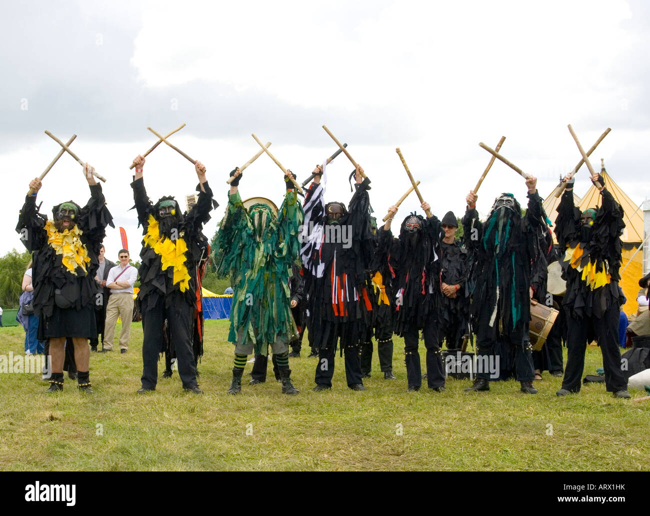 Line of Bedlam Morris Dancers in Black Rag Robes Pose with Sticks ...