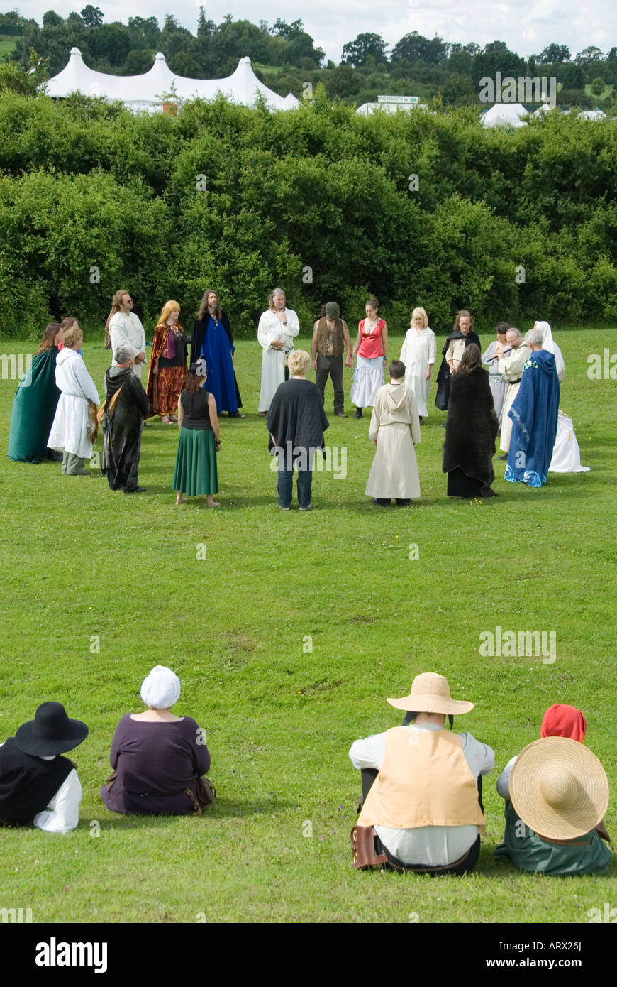 Medieval Reenactors Sit Watching Circle of Worshippers at Druid ...