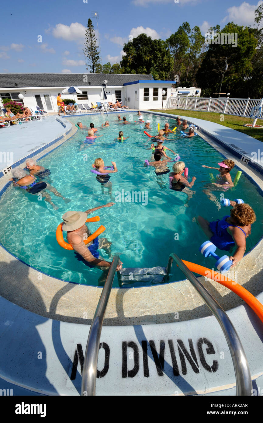 Senior citizens enjoying retirement in a resort swimming pool Stock ...