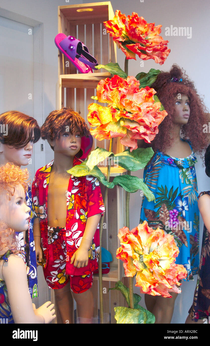 Tropical clothes display in a shop window in Georgetown Bermuda Stock ...
