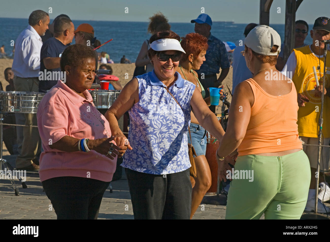 People Dancing Along The Boardwalk At Coney Island New York City Stock