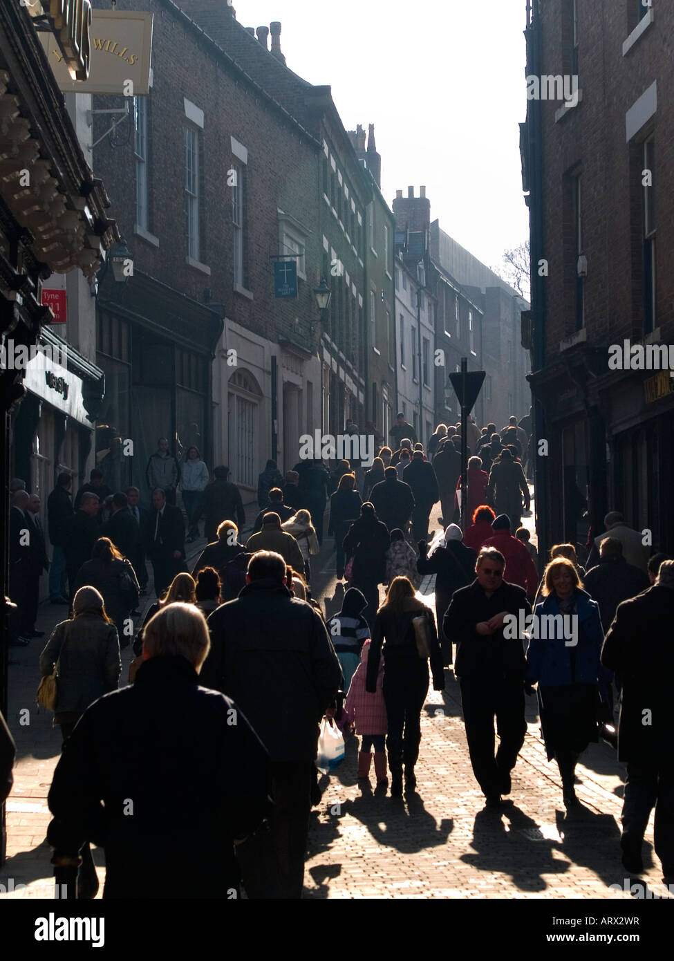 A crowd of people walking up Saddler Street in Durham UK Stock Photo ...