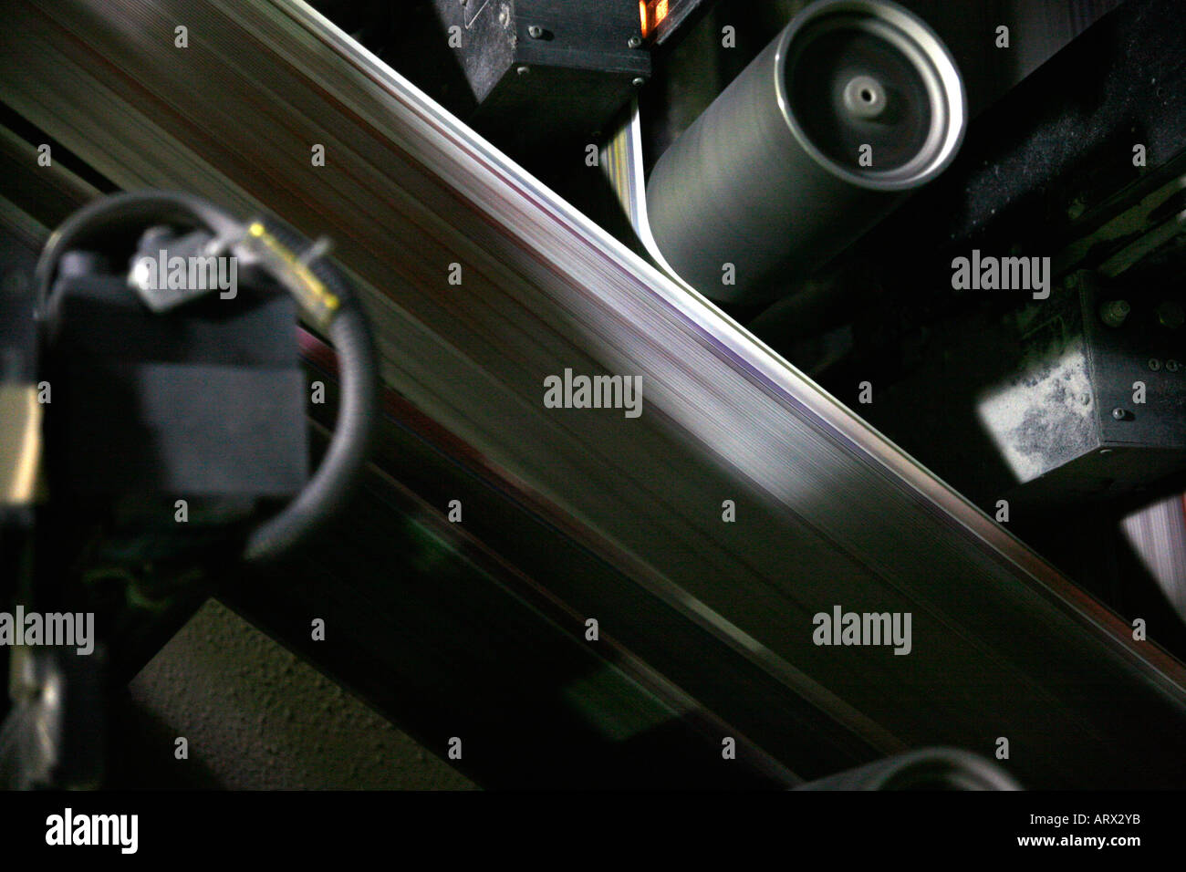 Paper speeding through the presses at a magazine print works, England ...