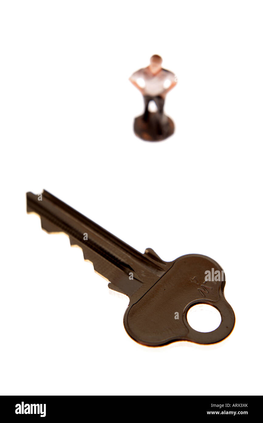 Key and figure on white Stock Photo - Alamy