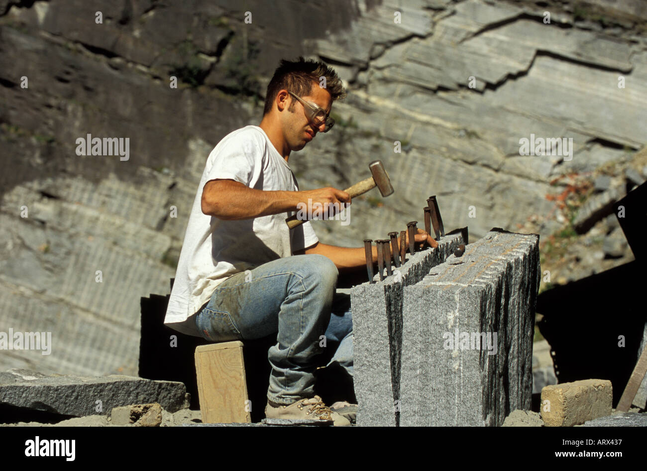 Stone Craftsman Splitting Large Granite Block for Building Construction ...