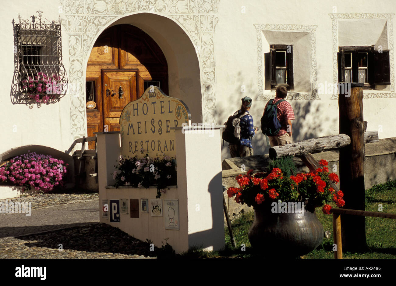 Mountain Village of Guarda Couple Walking the Main Street, Engadine ...