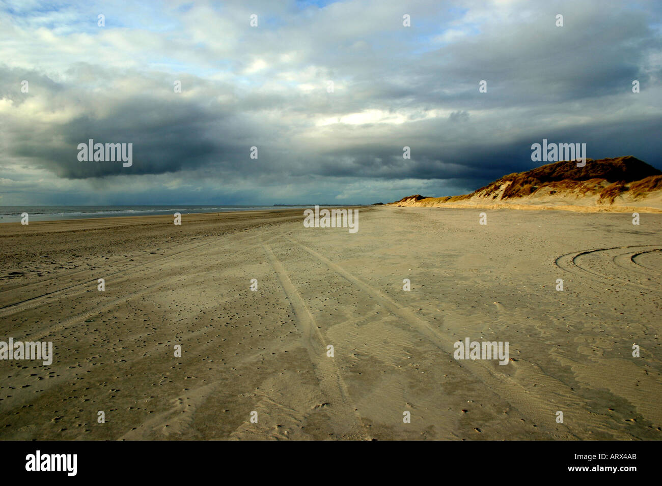 Beach whit strange sun light and black clouds in October at the ...