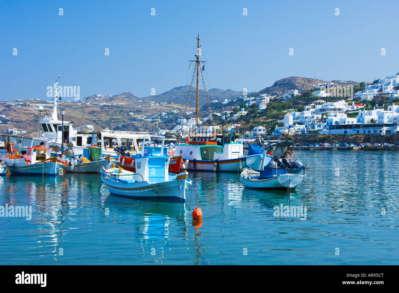 The port of Hora with colorful fishing boats on the Greek Island of ...