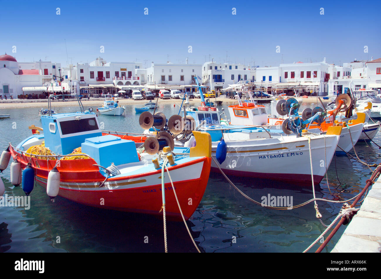 The port of Hora with colorful fishing boats on the Greek Island of ...