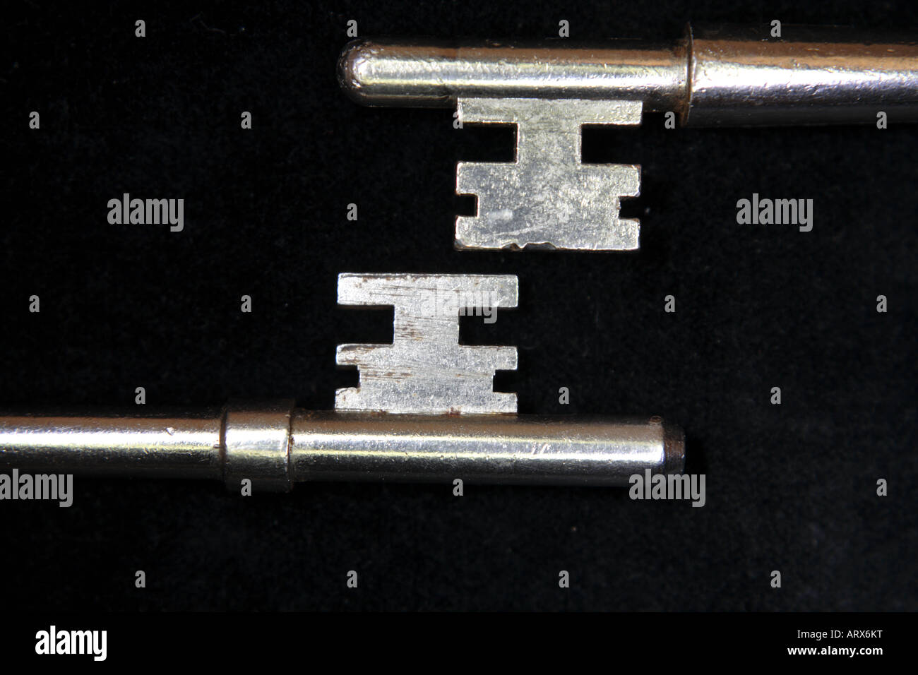 Two keys on black Stock Photo - Alamy