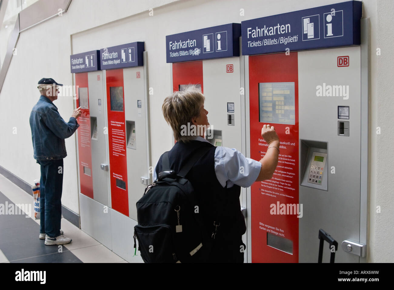 Buying tickets at self service ticketing machine German train station ...