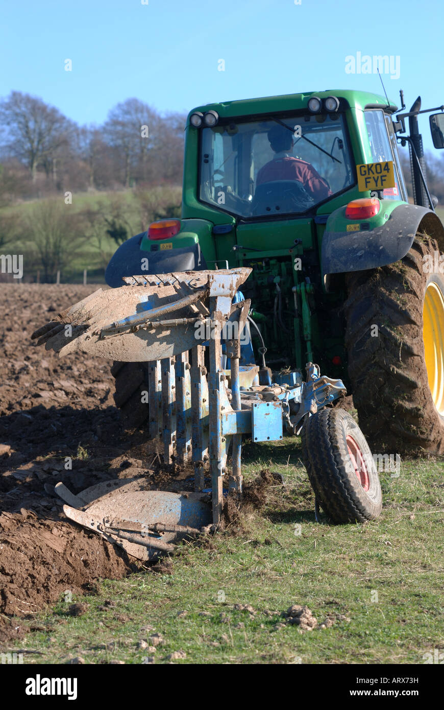 Tractor ploughing field ready for crops in Kent Stock Photo - Alamy
