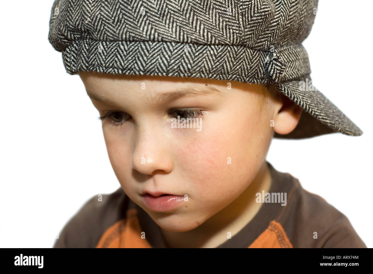 Sad six year old thinking about something On white background Stock ...