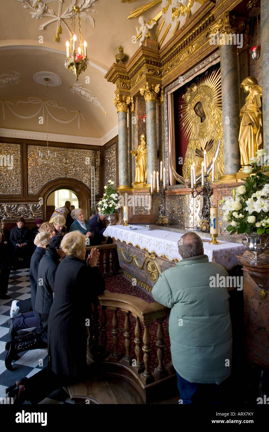 Pilgrims praying to the icon of the virgin in the 16th century Gates of ...