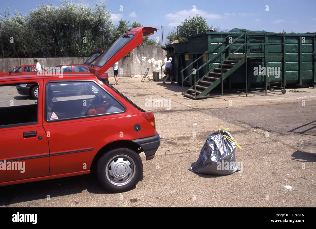 Red Ford Fiesta car being used to transport waste to local community ...