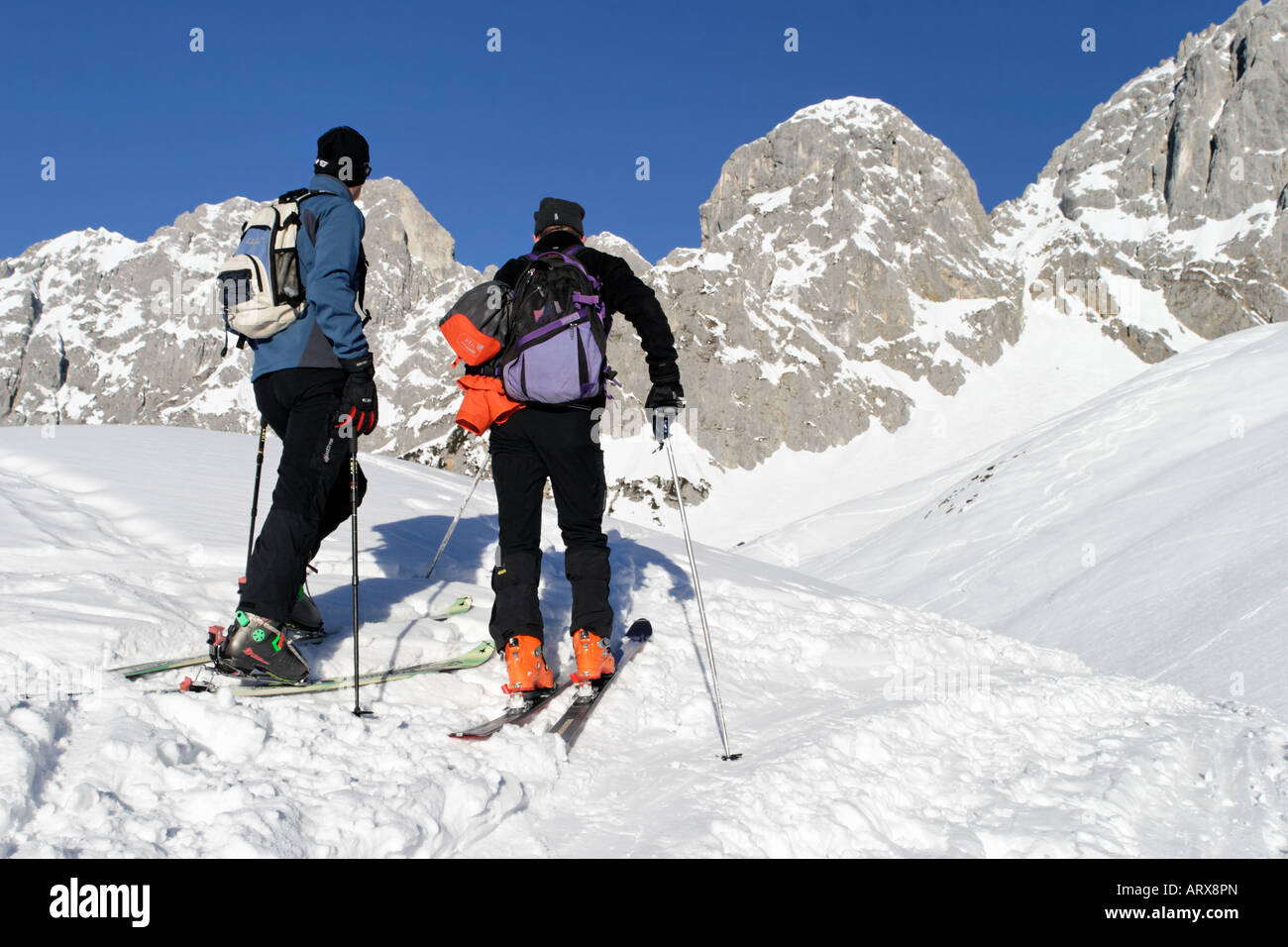 Mountaineers enjoying a moments rest whilst deciding the best descent ...