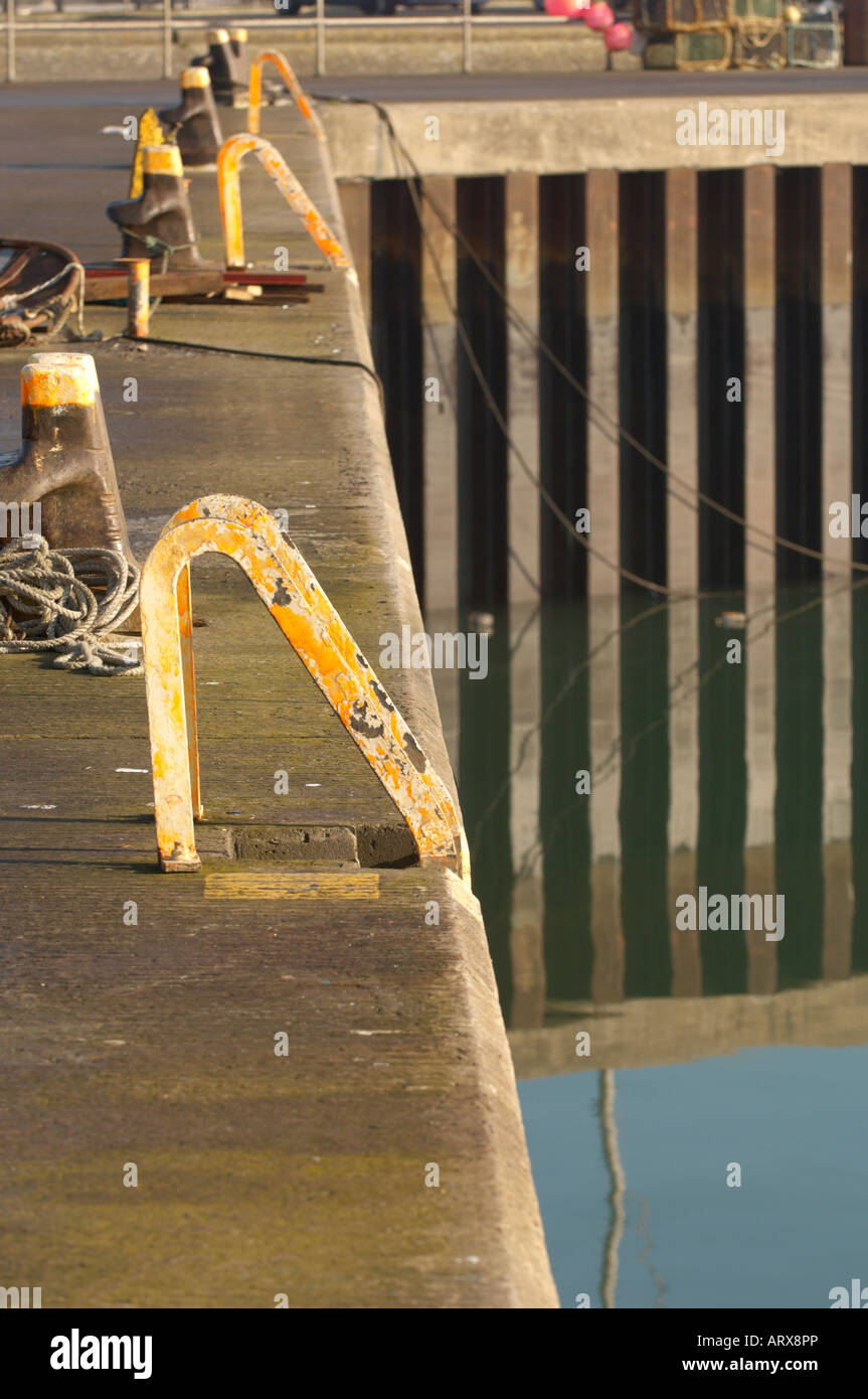 Harbour wall with steps and mooring points Stock Photo - Alamy