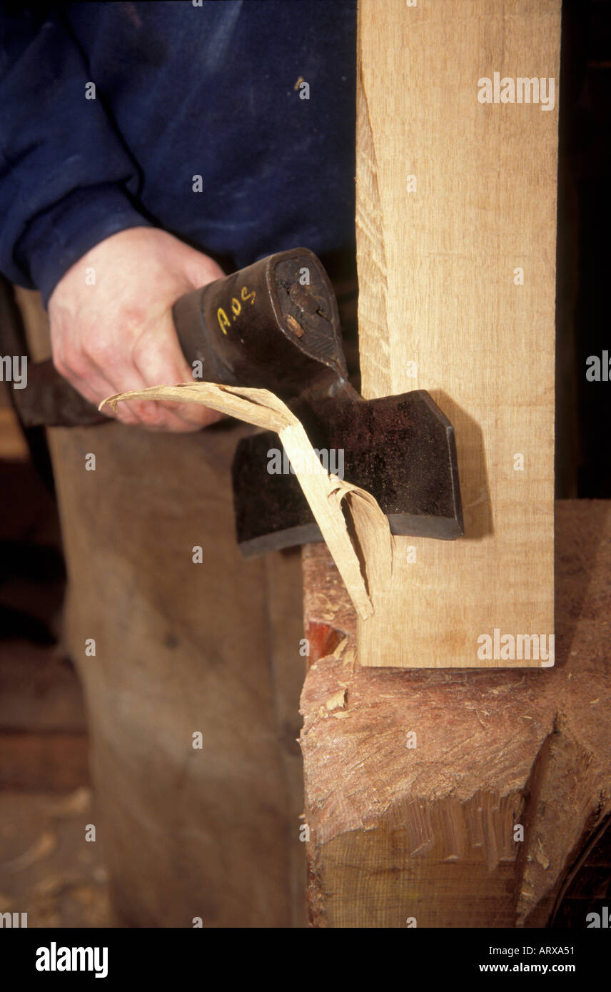 Cooper Alastair Simms using a side axe to cut staves to made the side ...