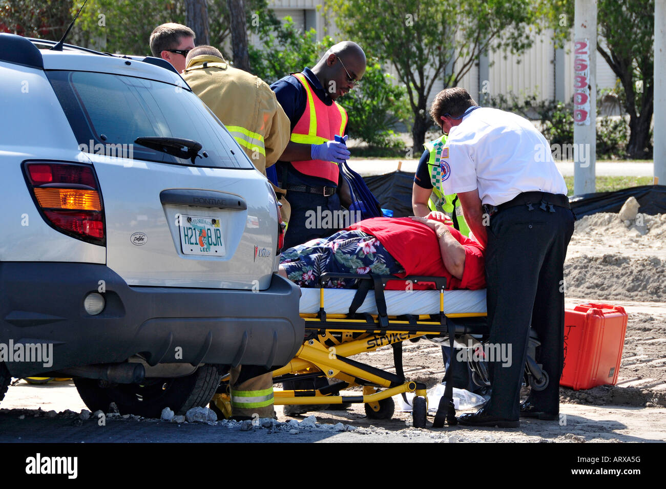 Emergency medical workers at scene of accident Stock Photo - Alamy